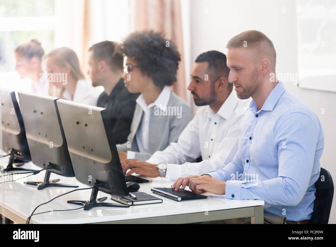 Black operator using computer in hi-res stock photography and images ...
