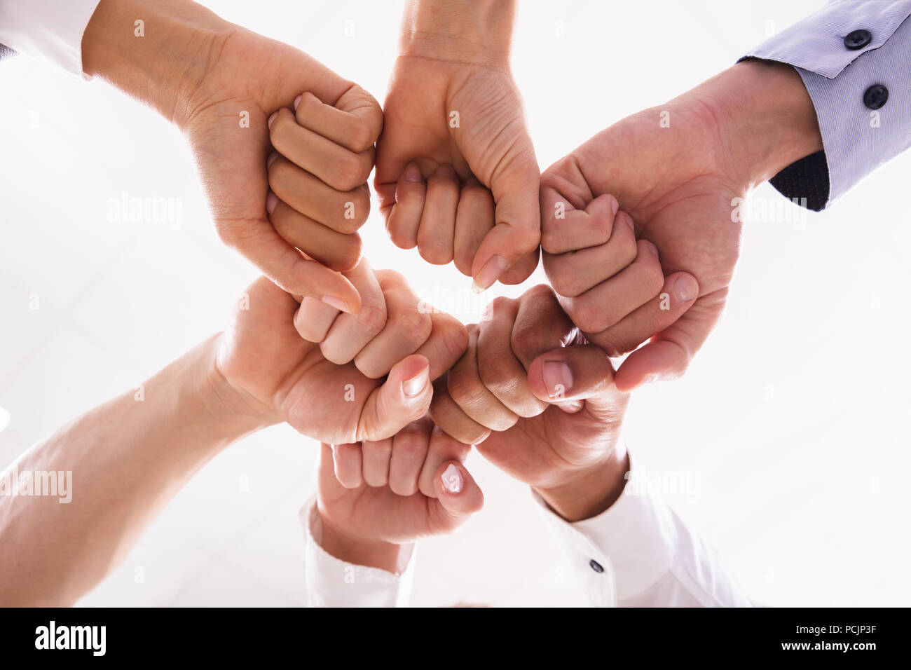 Black hands group fist bump hi-res stock photography and images - Alamy