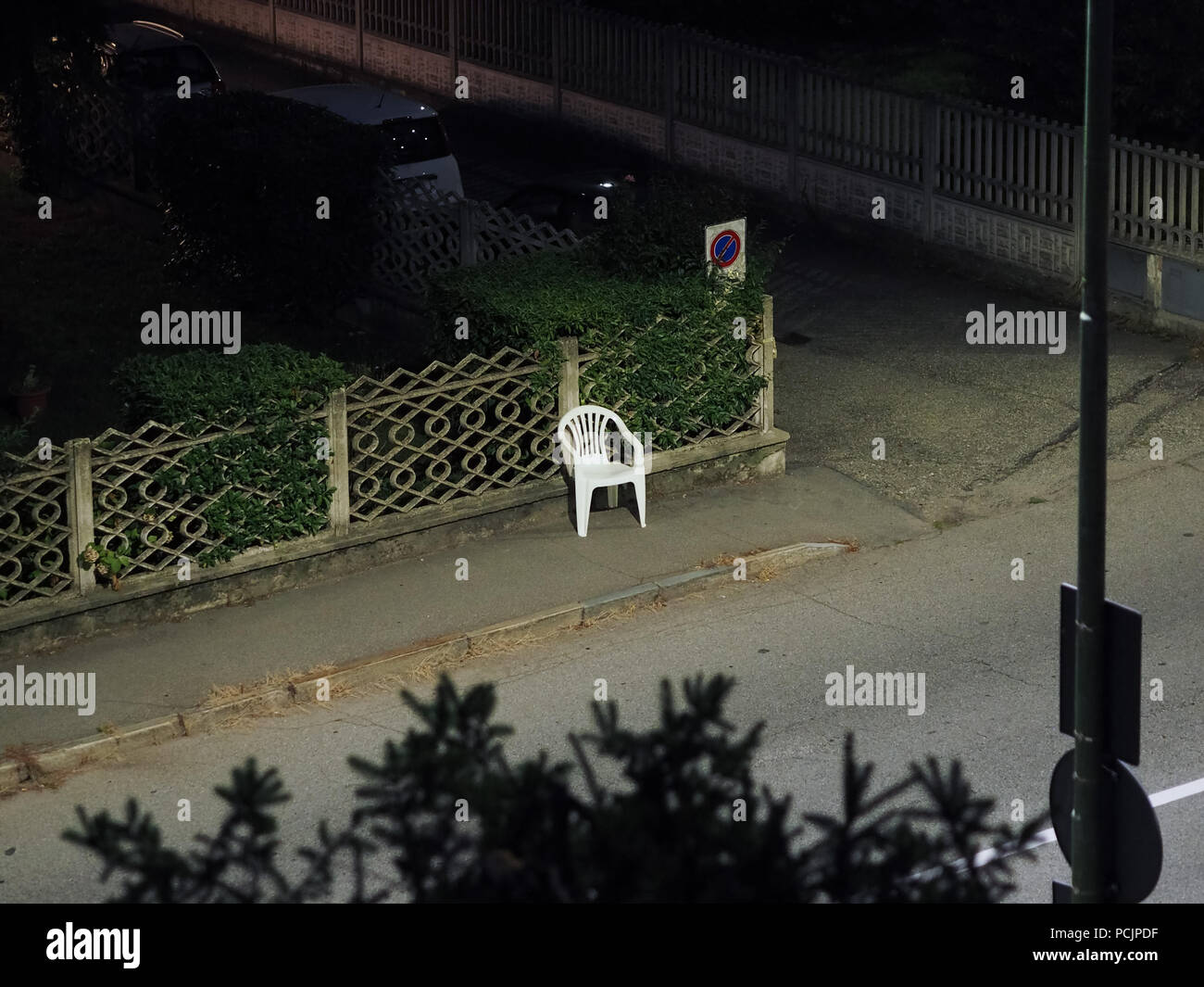empty plastic chair outdoor in the street at night Stock Photo - Alamy