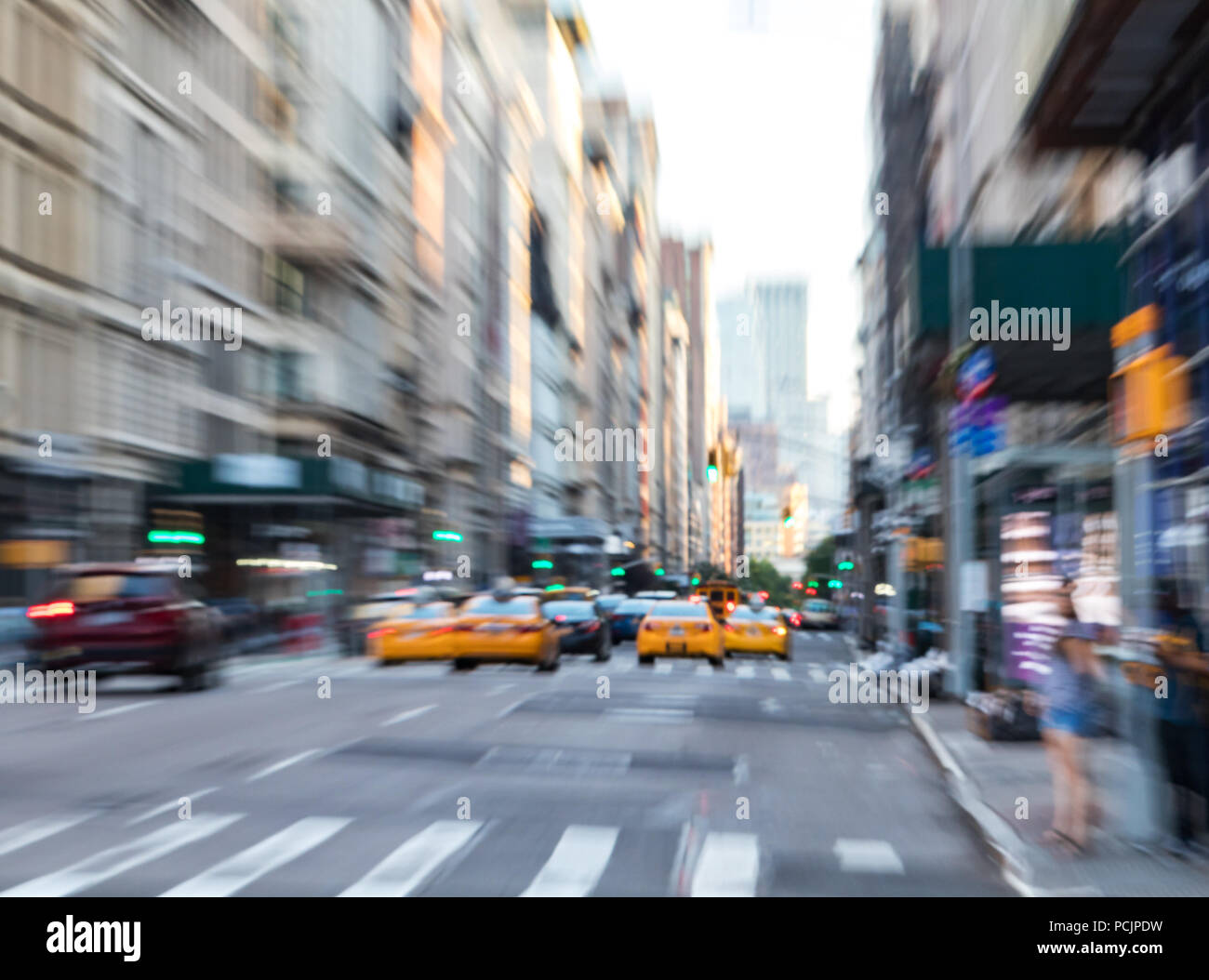 Fast moving taxis on Fifth Avenue in Manhattan New York City blurred ...