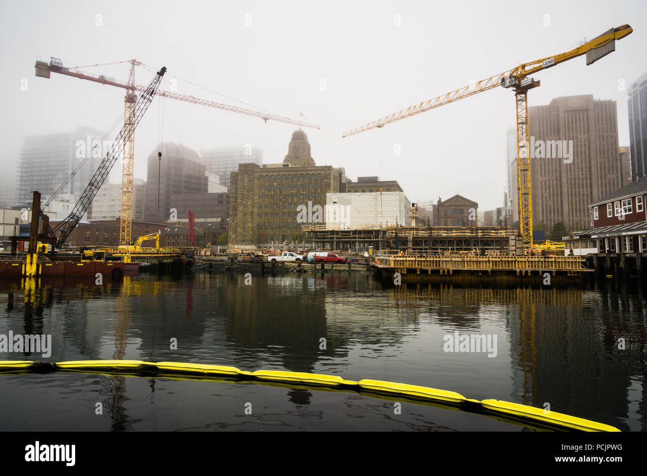 Tower cranes and construction equipment working on a new development on ...