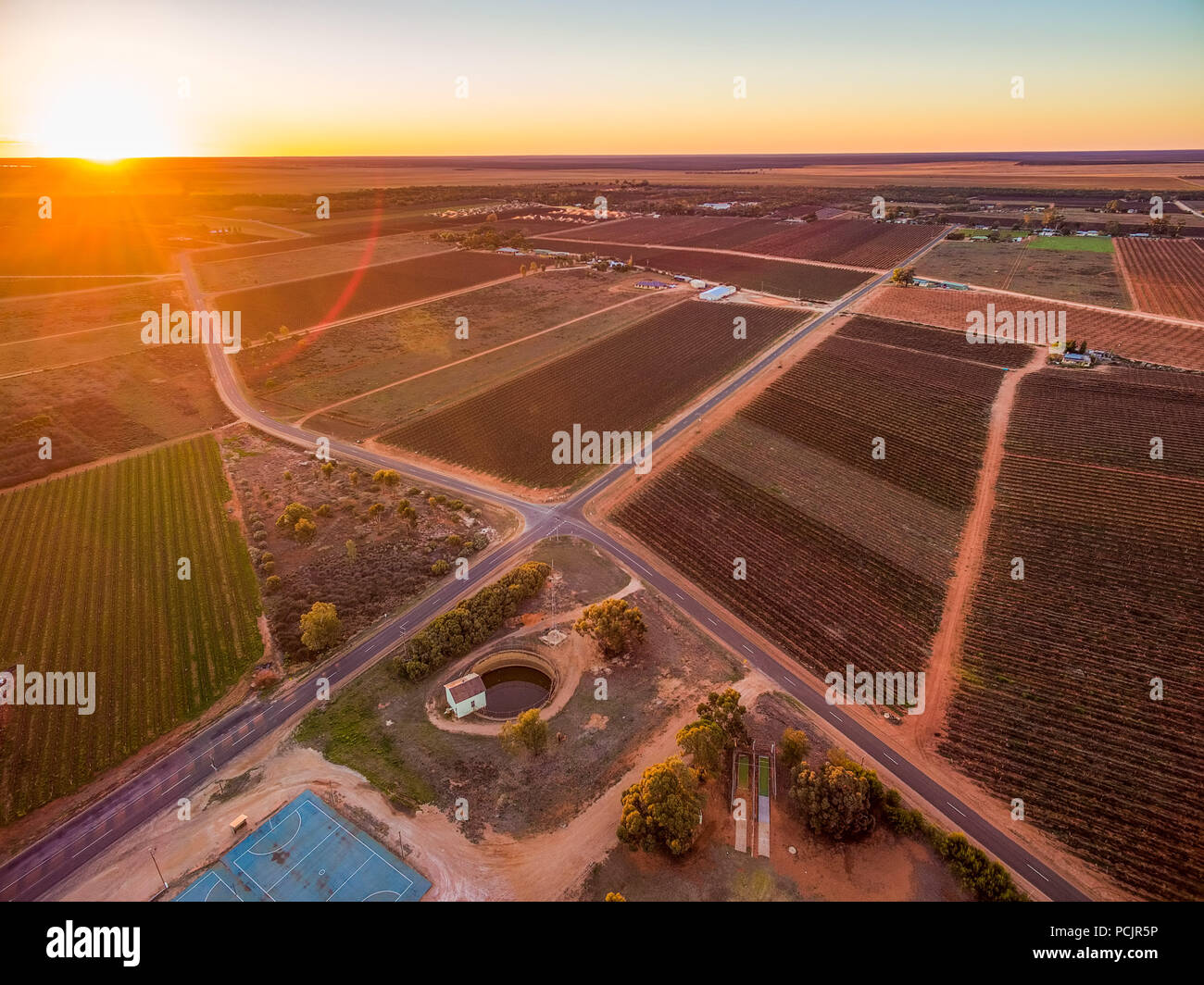 Sunset with sun flare over agricultural areas in Riverland, South ...