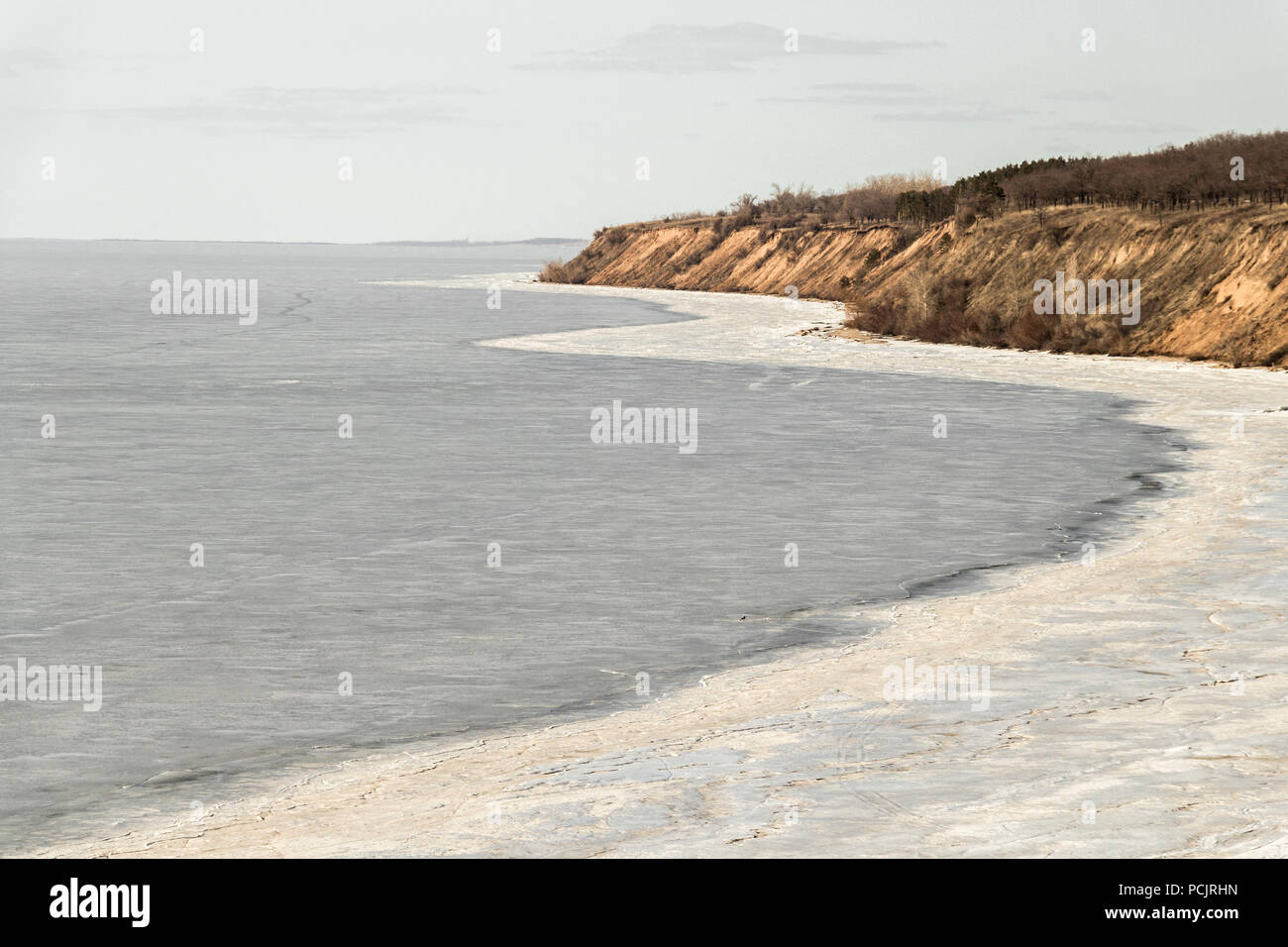 The high bank of a large frozen river Stock Photo - Alamy