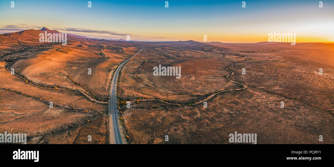 The Outback Highway passing through Flinders Ranges at dusk - aerial ...