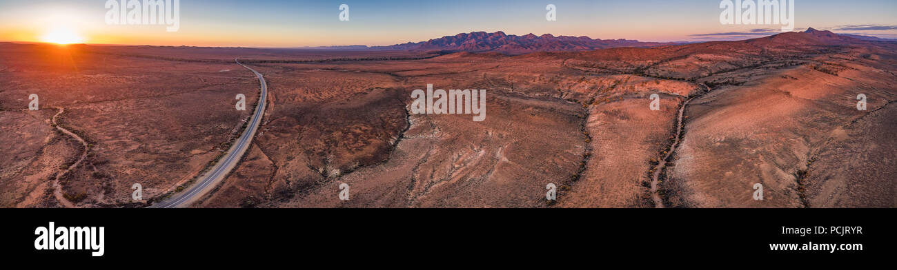 Flinders Ranges peaks at orange sunset - aerial panorama Stock Photo ...