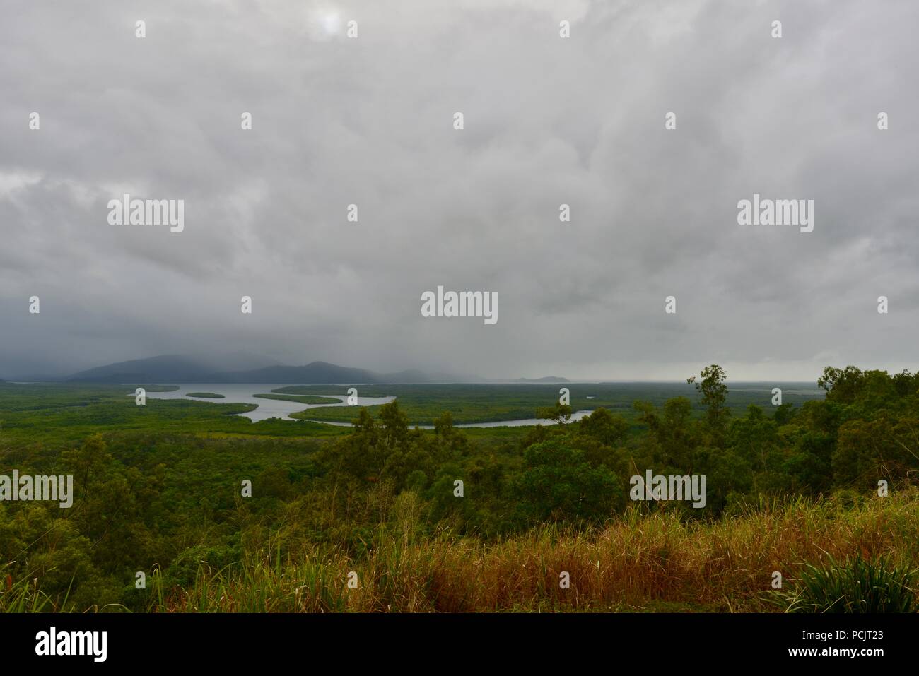 Hinchinbrook island on a cloudy misty day as seen from the Hinchinbrook ...