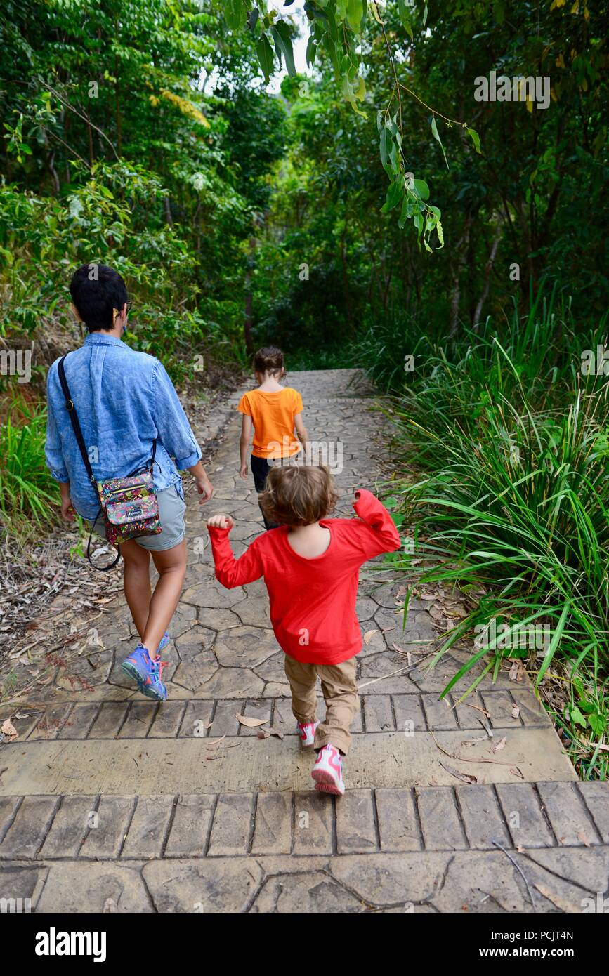 Mother and children walking down from Panjoo Lookout, Cardwell ...