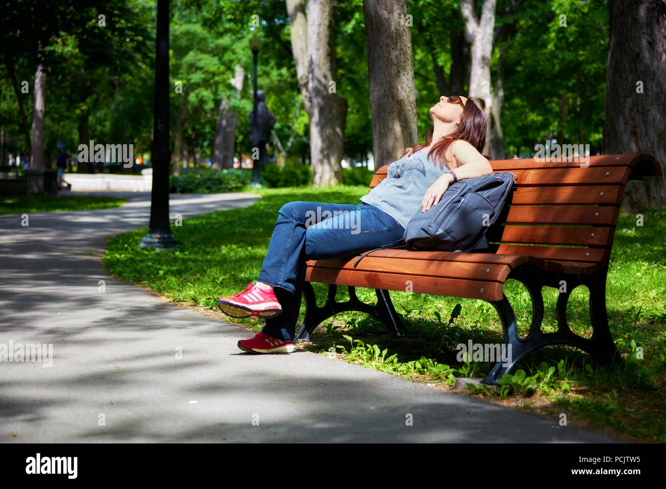 Woman sunbathing and park hi-res stock photography and images - Alamy