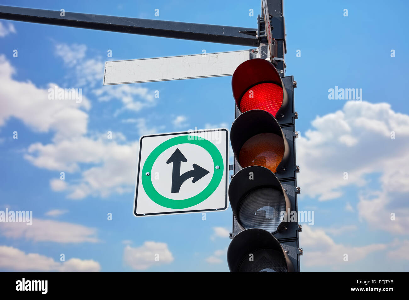 Empty street sign attached to a traffic light signaling red Stock Photo ...