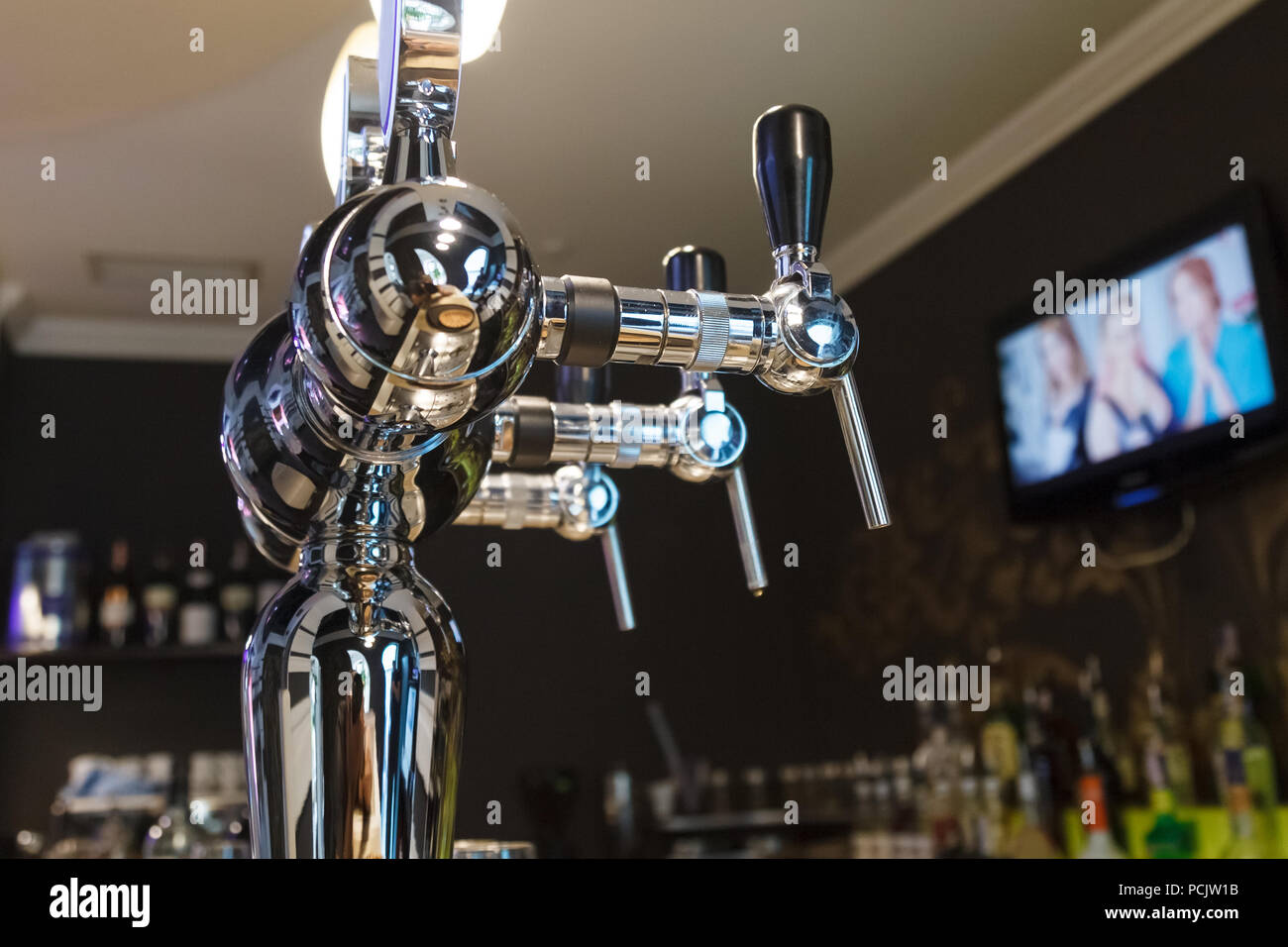 Crane defoamer for bottling beer installed on the bar in the restaurant ...