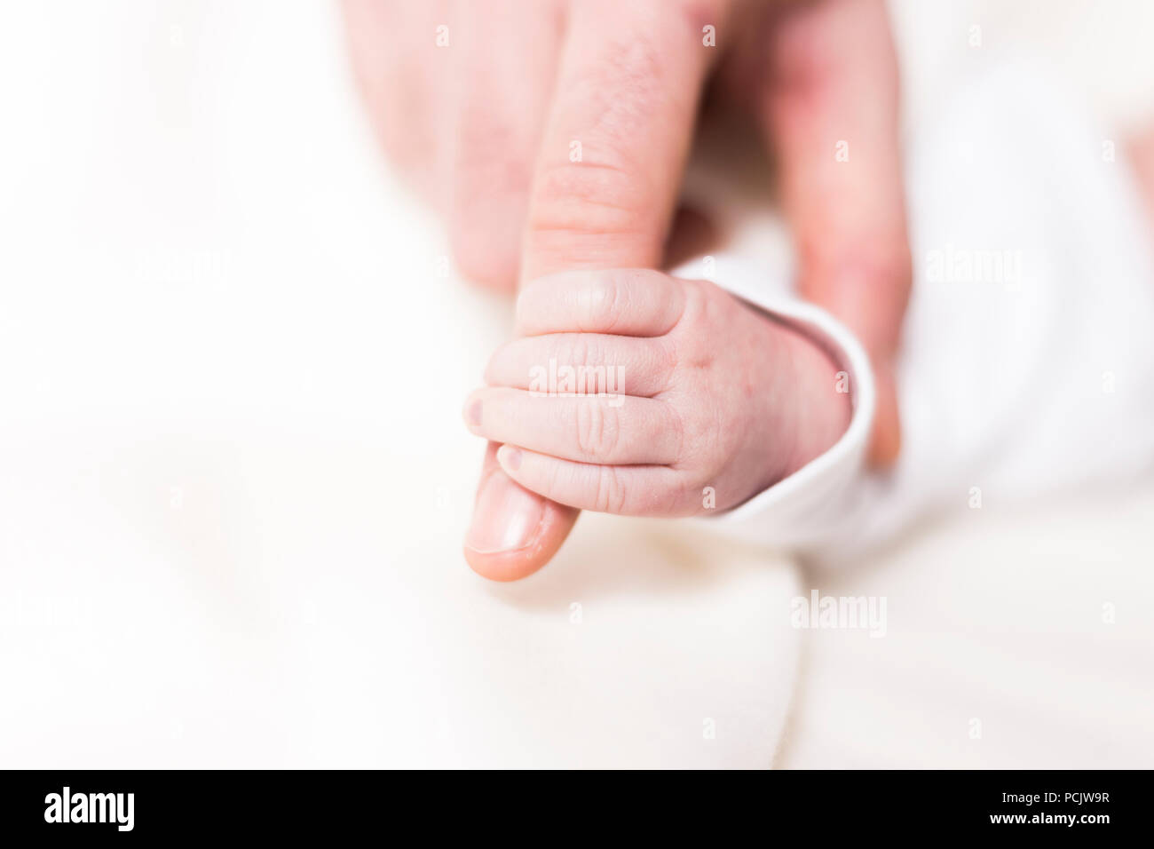 Babyhand hi-res stock photography and images - Alamy