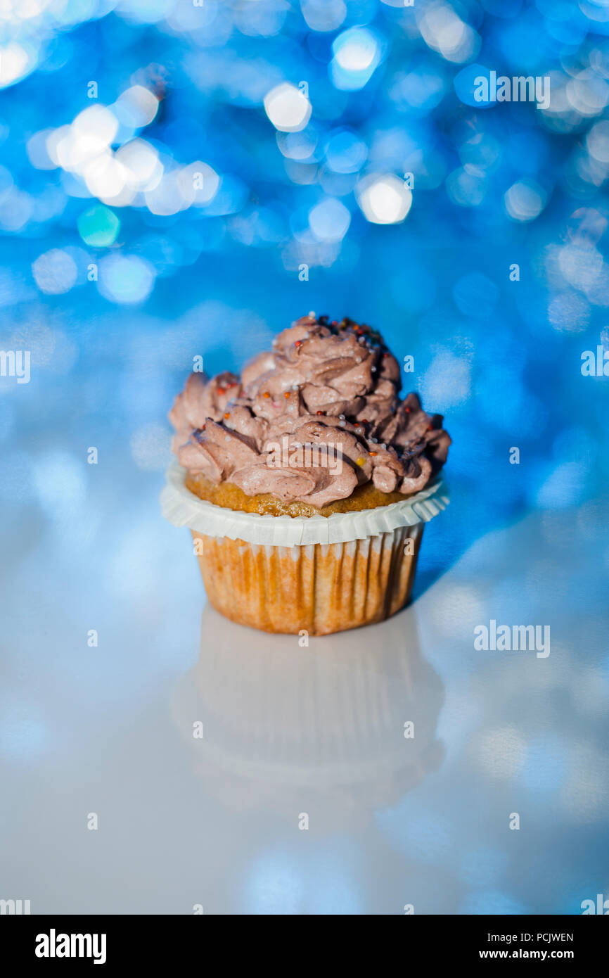 Single cupcake sweet party food dessert in blue Stock Photo - Alamy