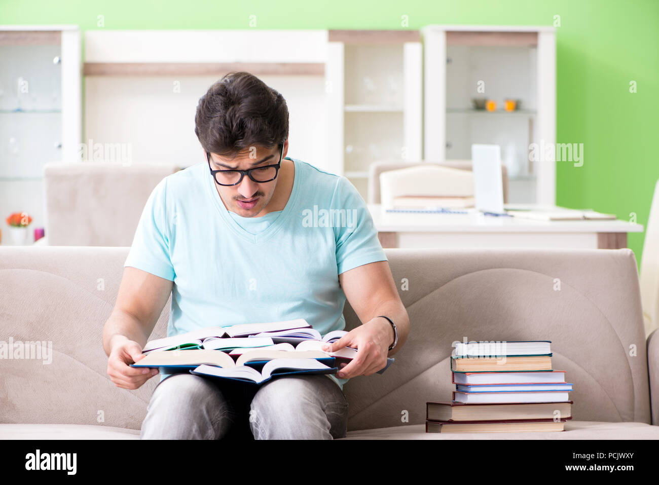 Student preparing for university exams at home Stock Photo - Alamy