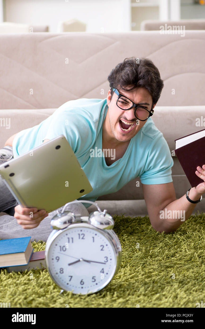 Student preparing for university exams at home in time management ...
