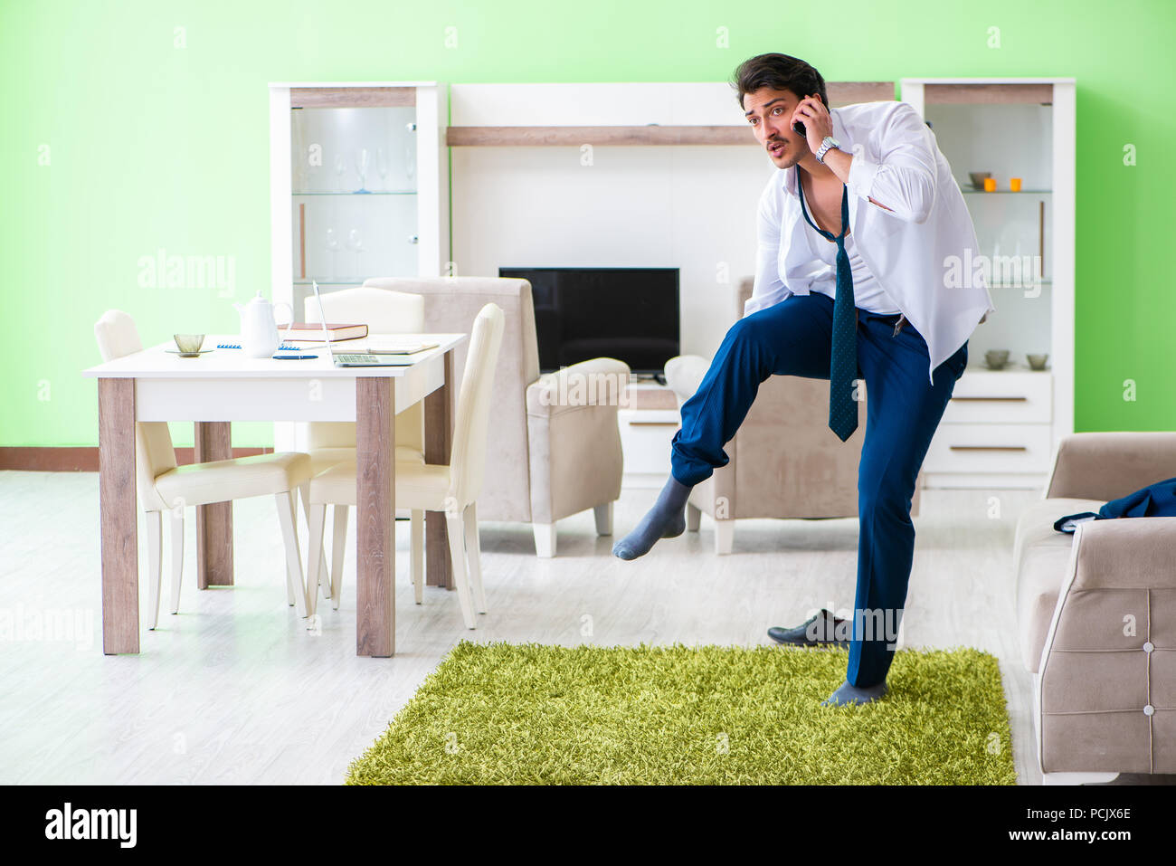 Man dressing up and late for work Stock Photo - Alamy
