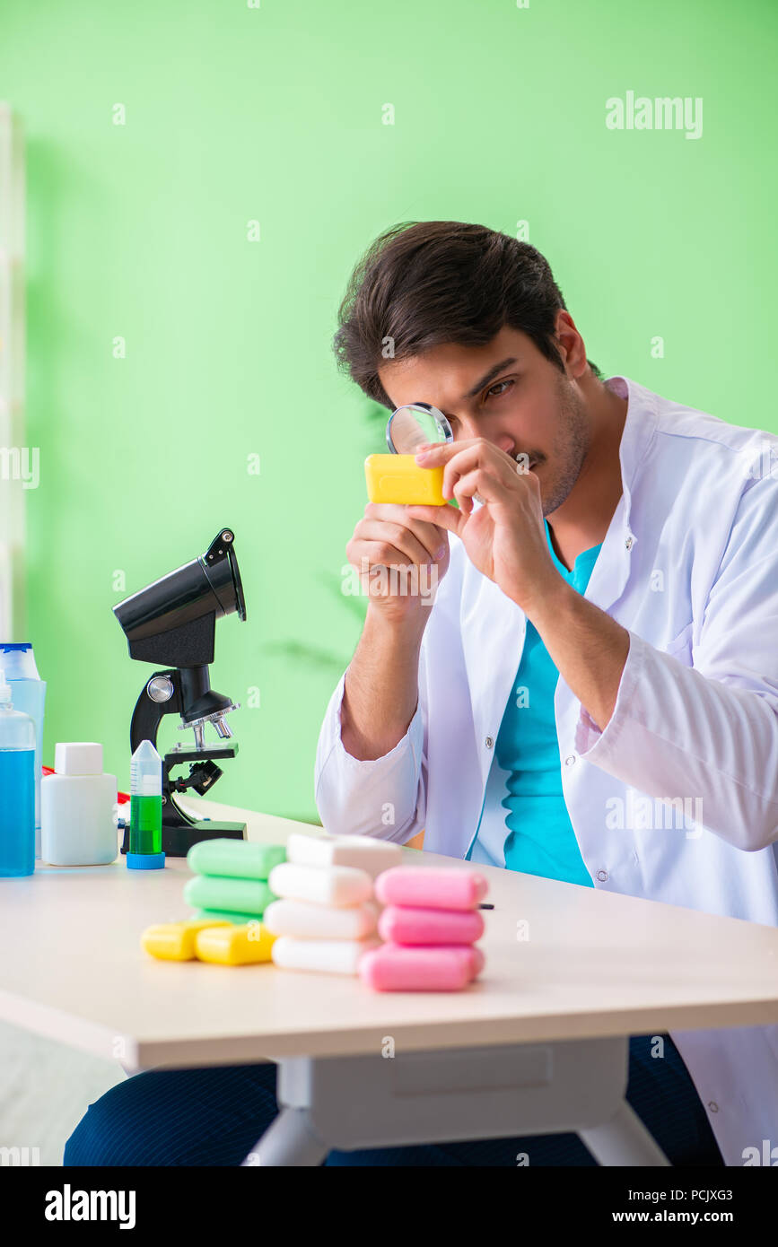 Chemist testing soap in the lab Stock Photo - Alamy