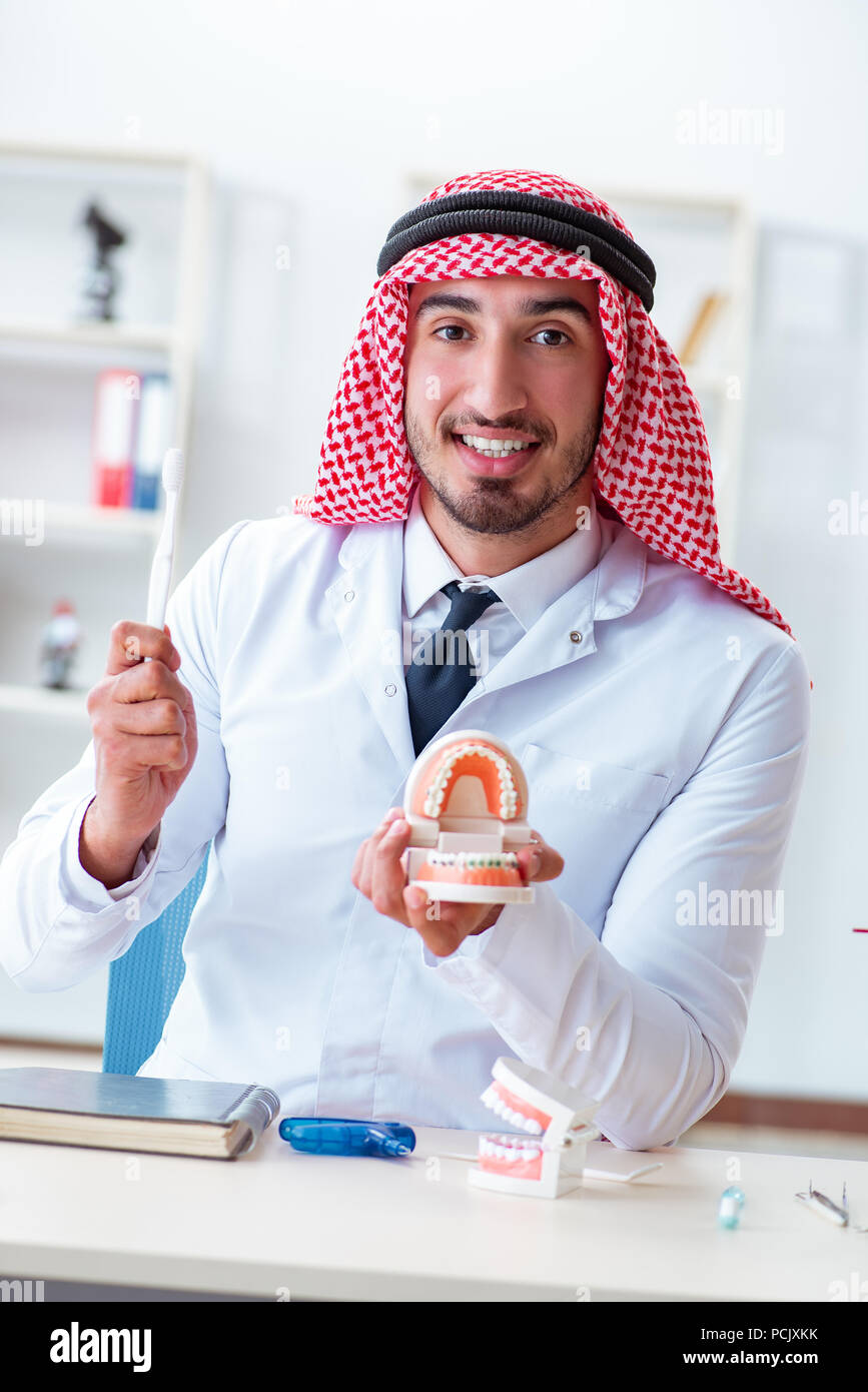 Arab dentist working on new teeth implant Stock Photo - Alamy