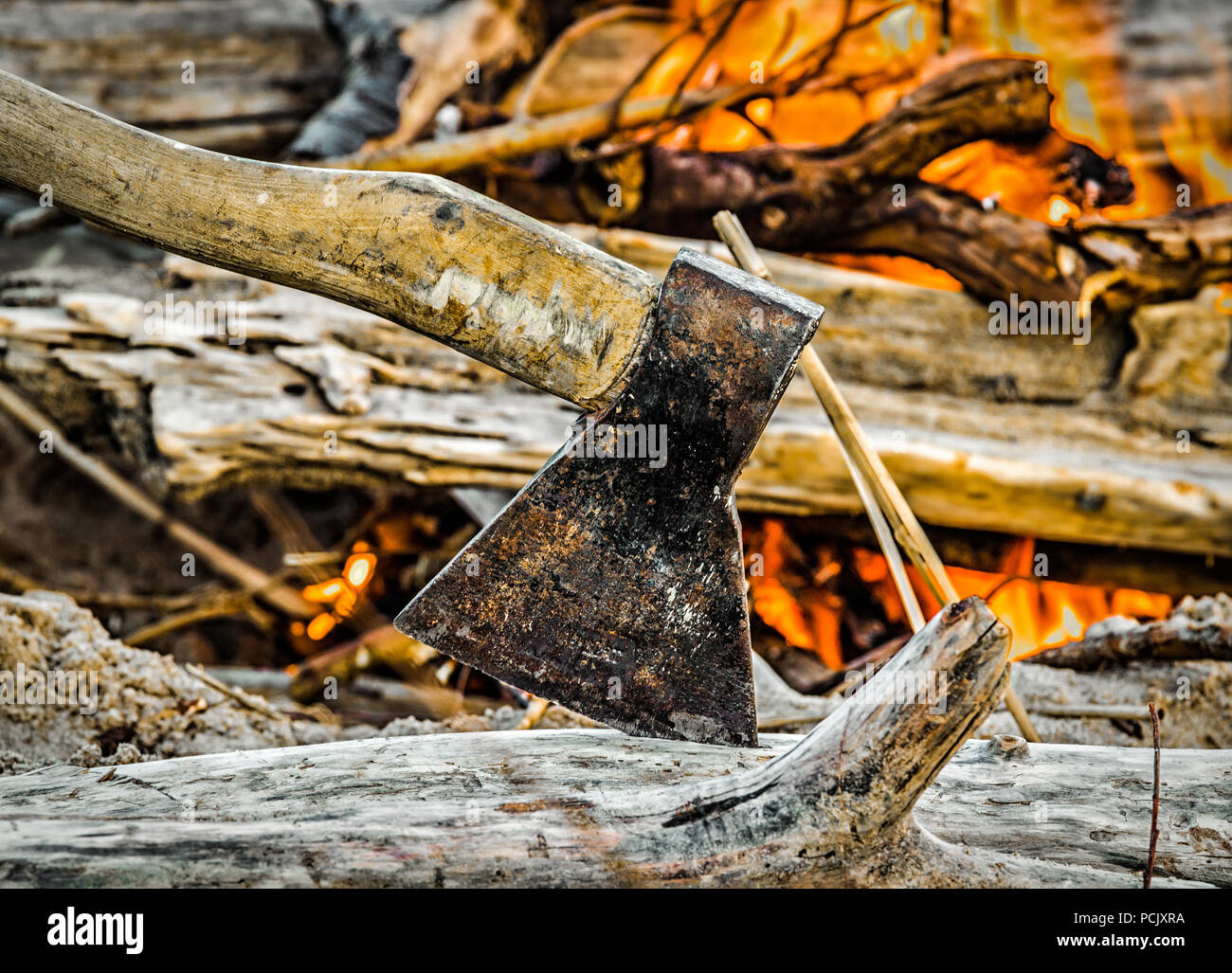 A small fire on the sandy river bank close-up Stock Photo - Alamy