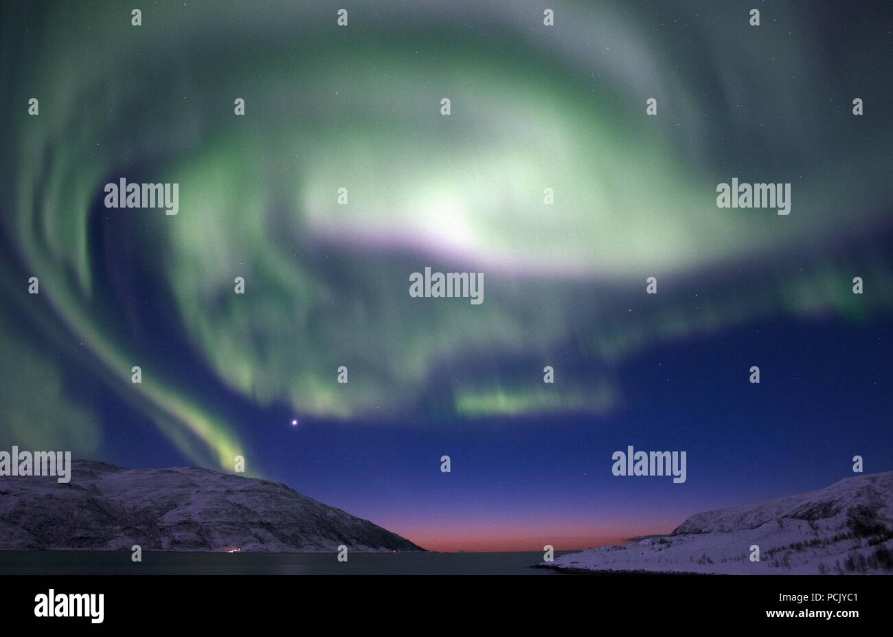 The northern lights (Aurora Borealis) over Indre Karvik, Tromso by a ...