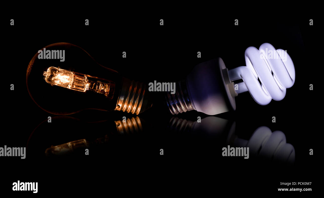 Cold and warm lightbulbs turned on with no wires on a black background ...