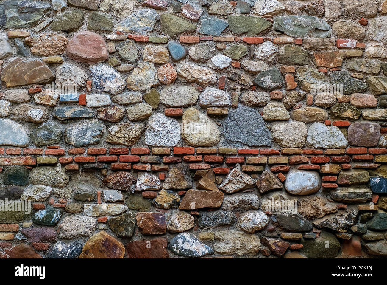 Wall of river stones Stock Photo - Alamy