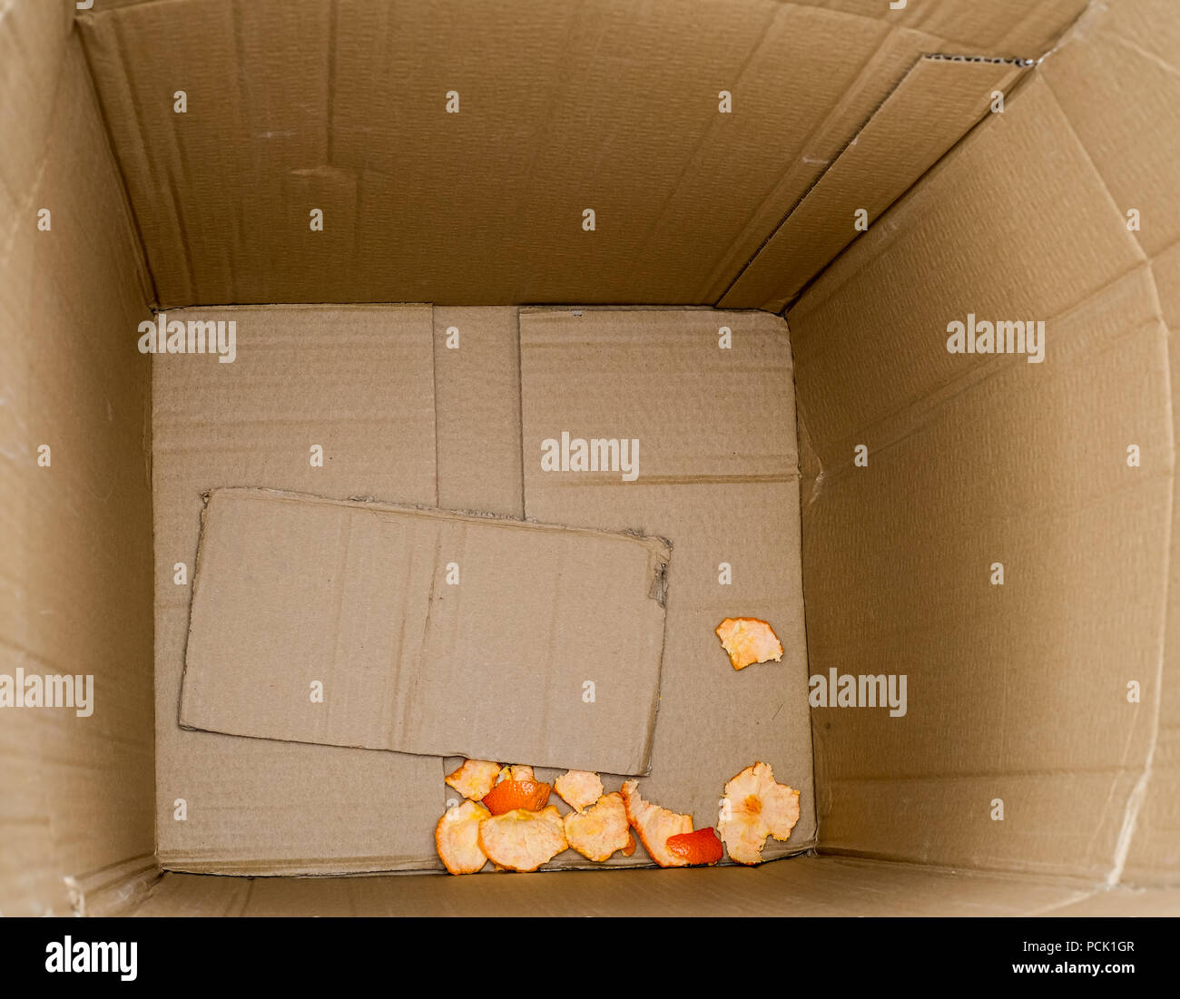 cardboard box with orange peel Stock Photo - Alamy