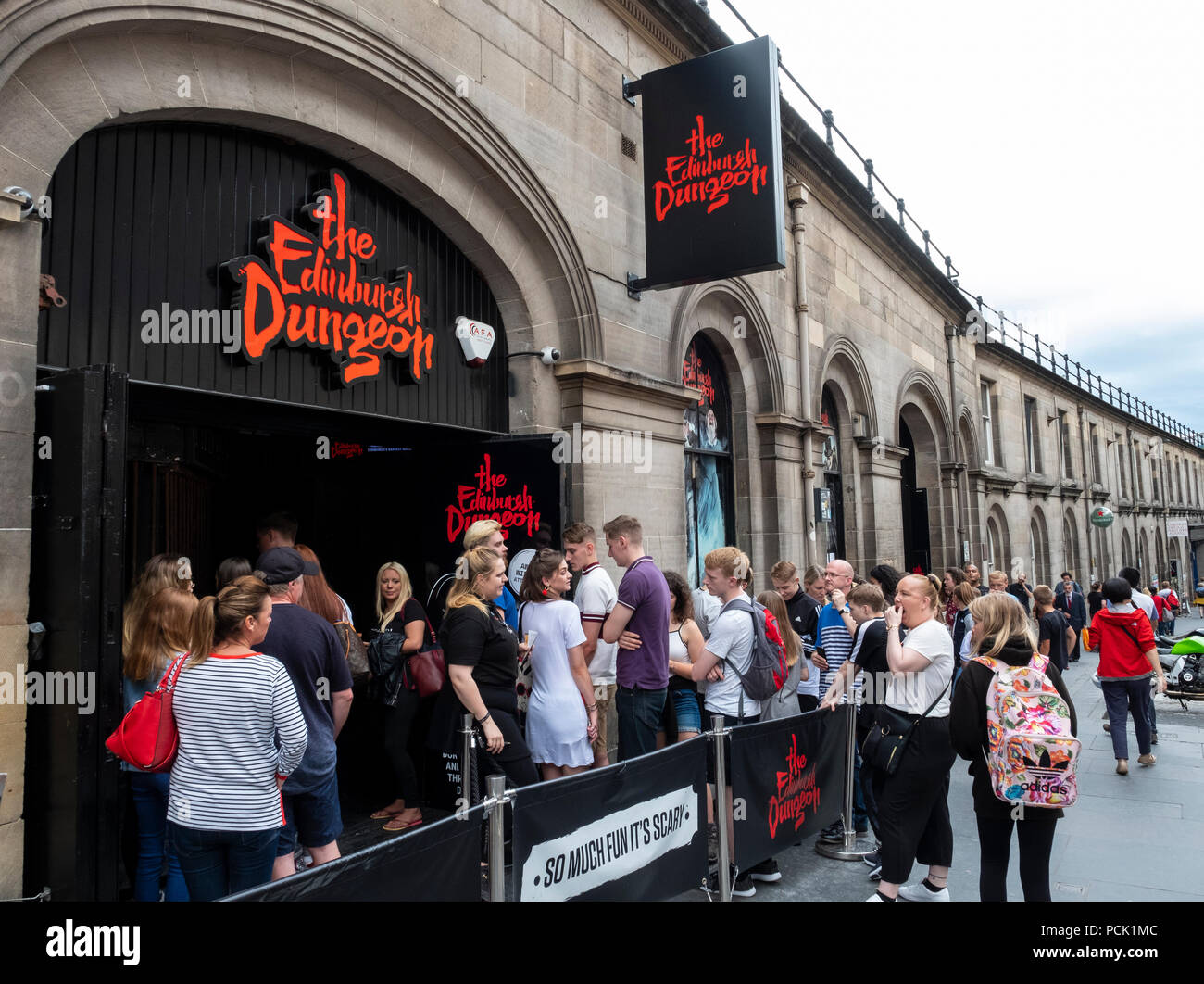 Tourists queue to enter Edinburgh Dungeon tourist attraction in ...