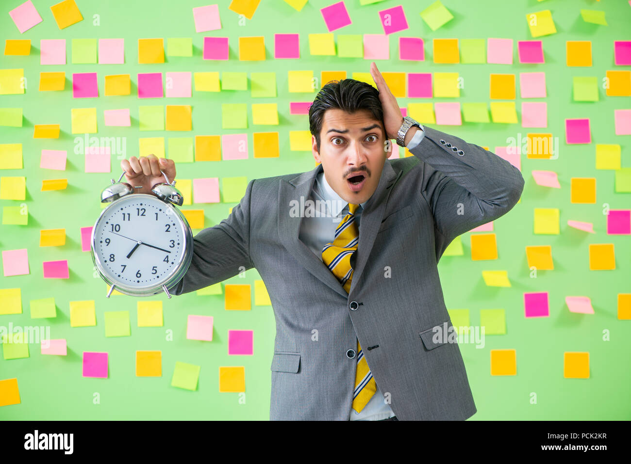 Businessman with many business priorities Stock Photo - Alamy
