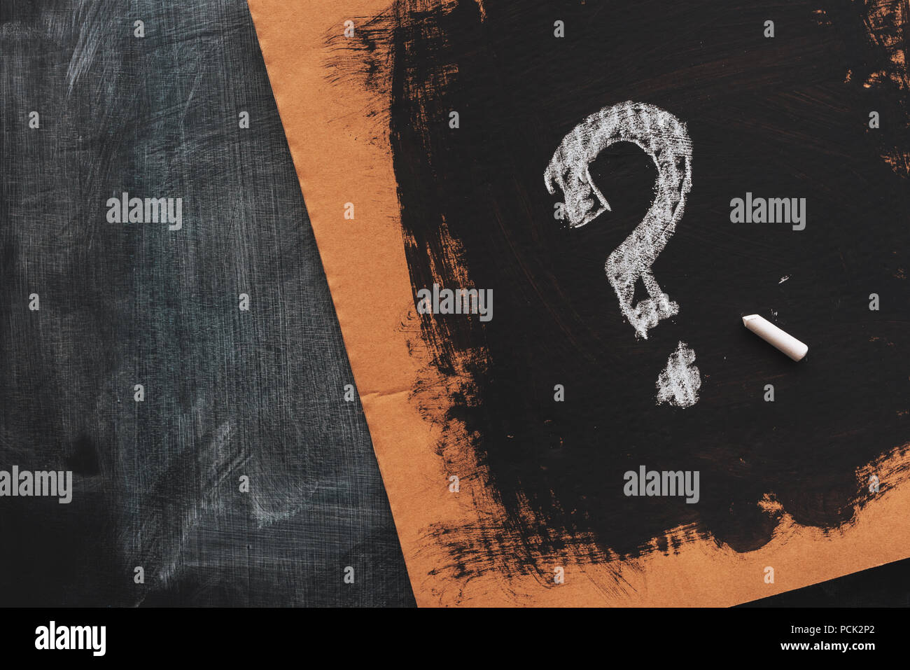 Sketched question mark on cardboard paper, concept of perplex and ...