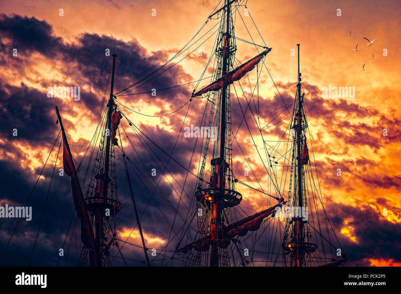 Pirate ship in sunset scenery Stock Photo - Alamy
