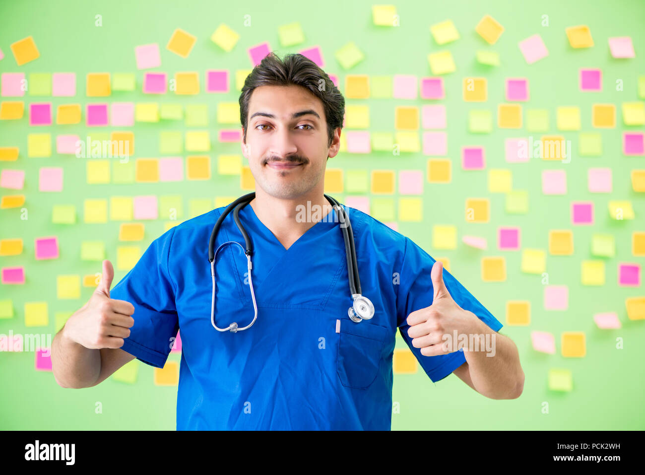 Young doctor with many reminders and urgent work Stock Photo - Alamy
