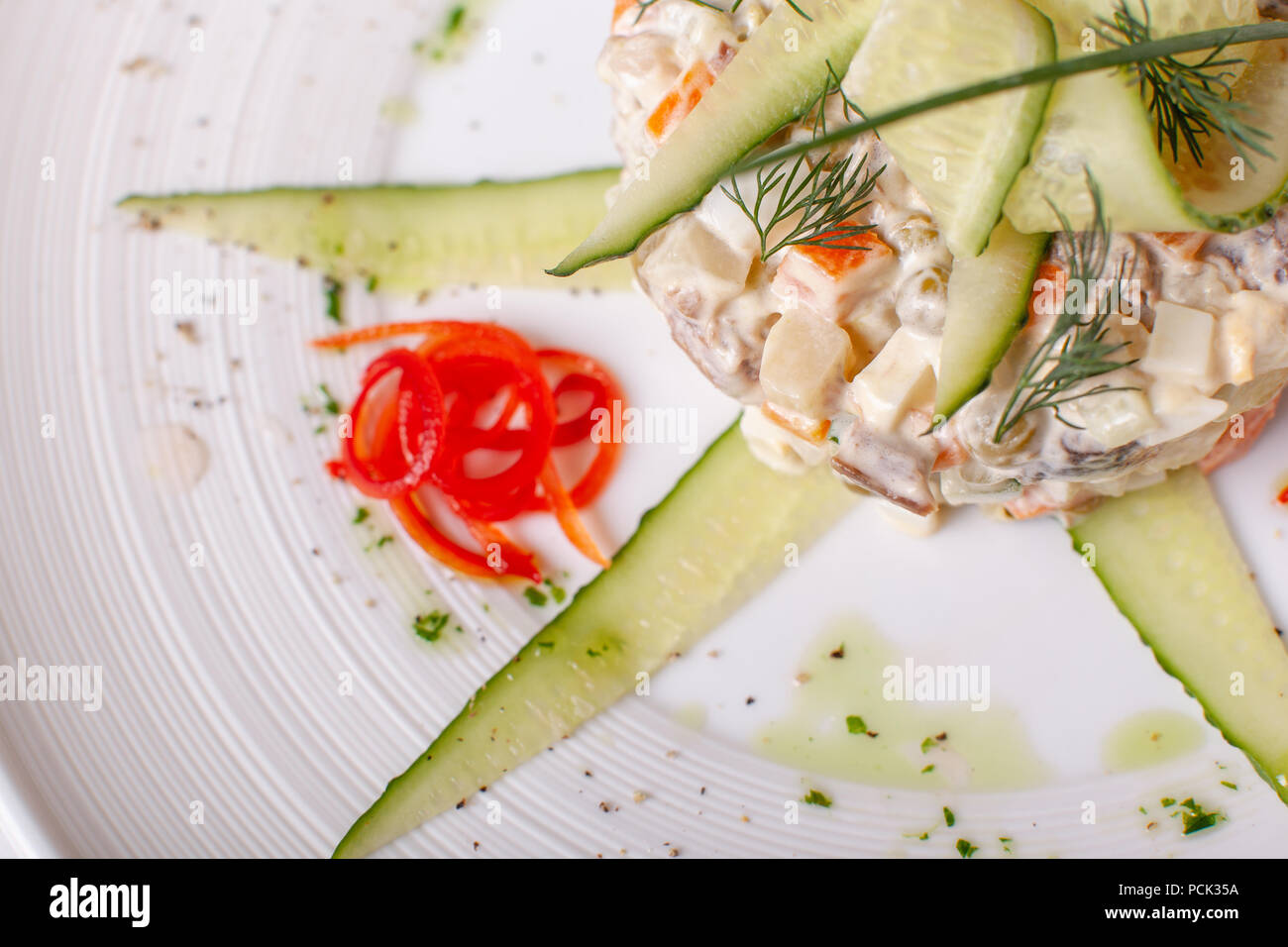 Russian traditional salad Olivier with vegetables and meat. Salad on a ...