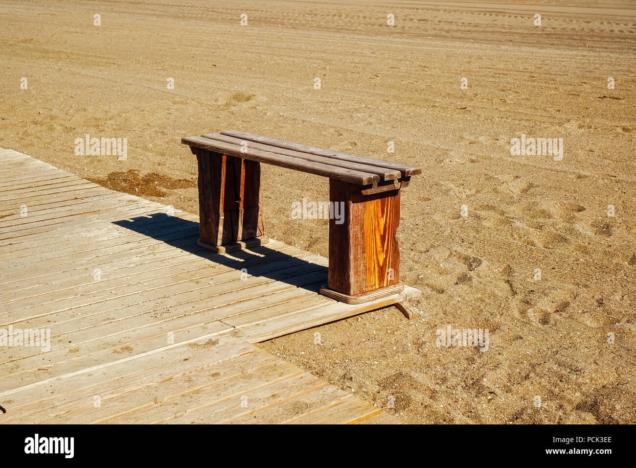 wooden bench on the beach Stock Photo - Alamy