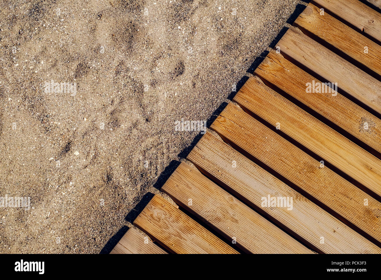 Wooden floor on sandy beach Stock Photo - Alamy
