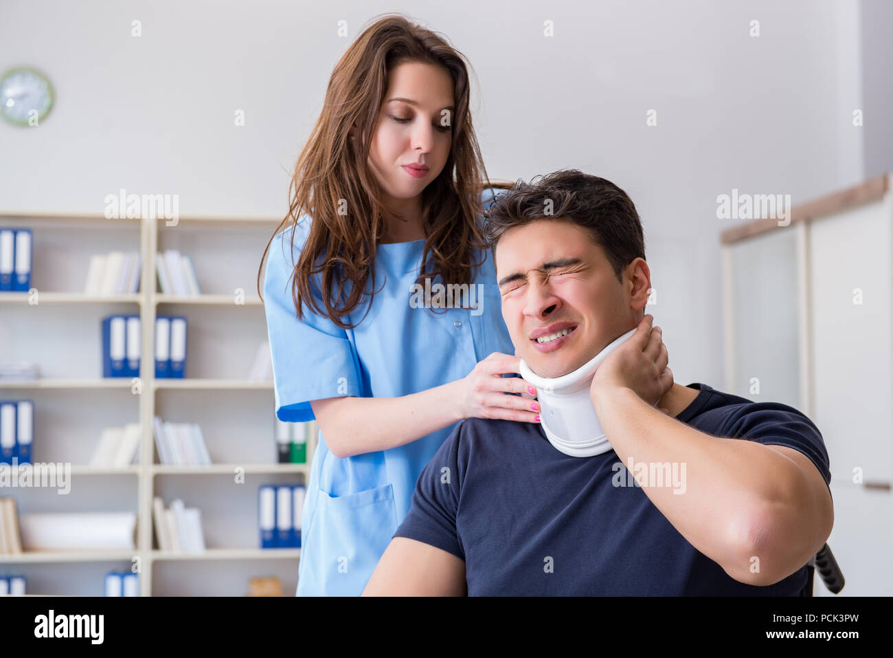 Man with neck injury visiting doctor for check-up Stock Photo - Alamy