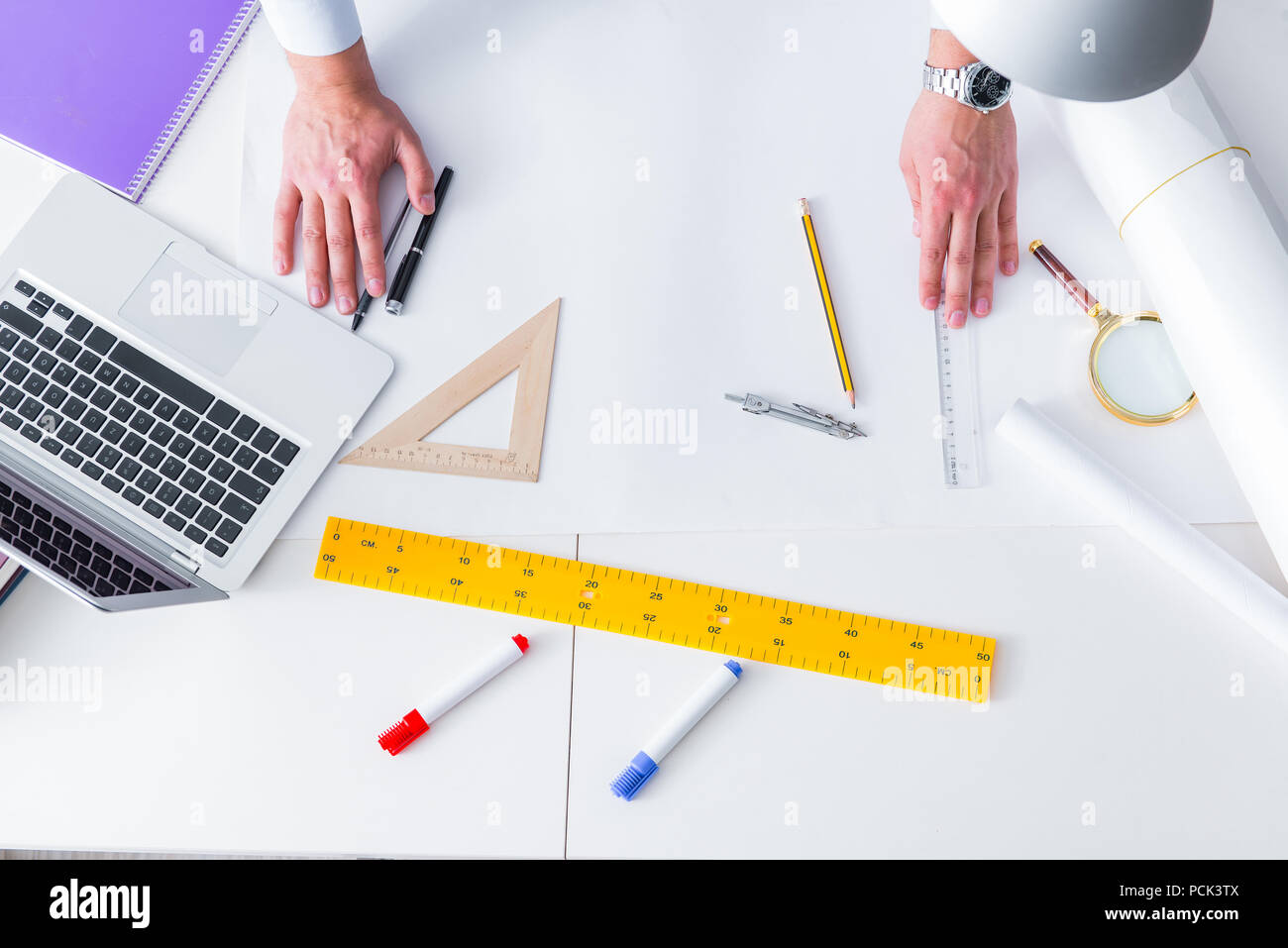 Engineer working on new project drawings Stock Photo - Alamy