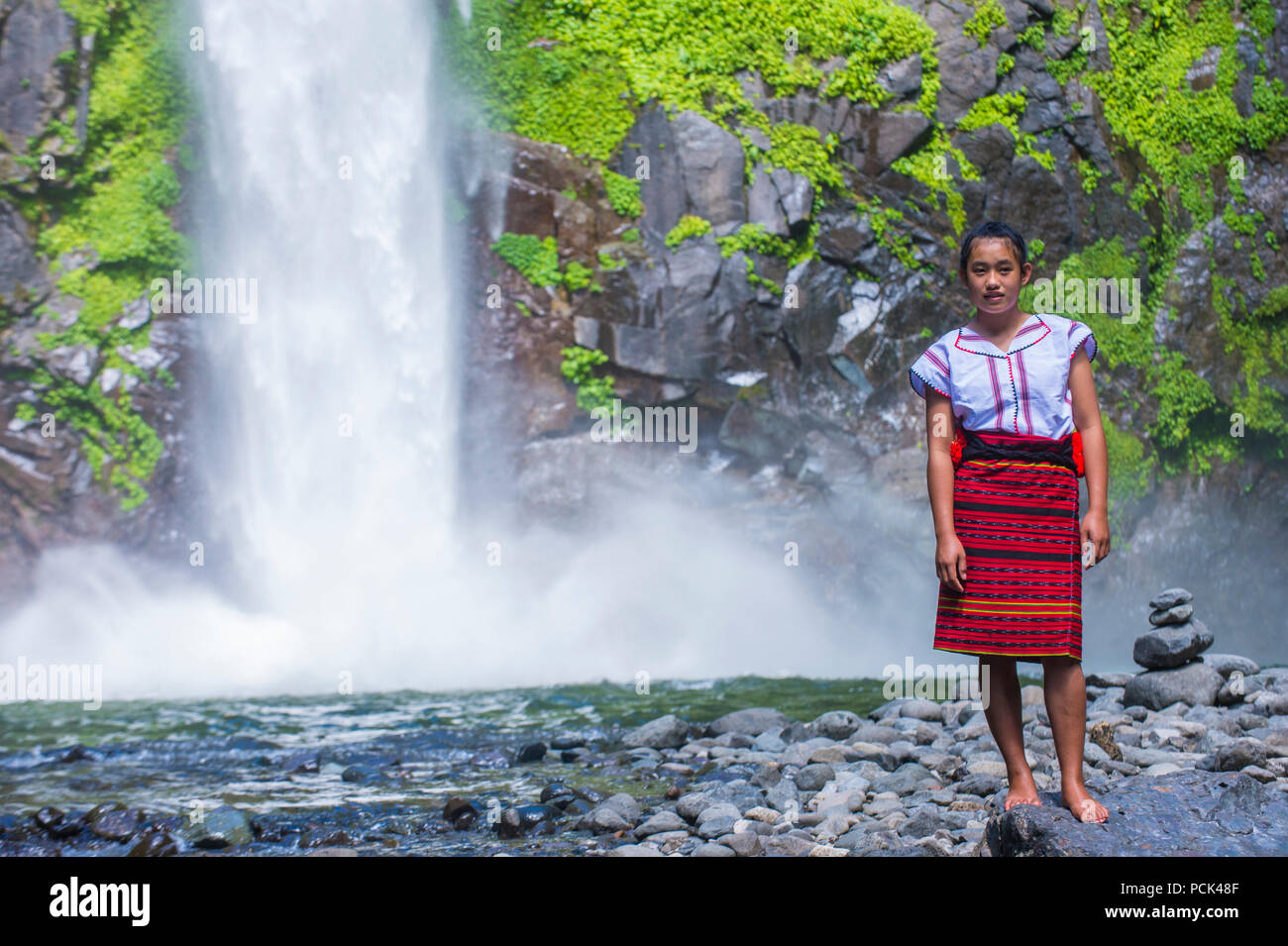 Girl from Ifugao Minority near a waterfall in Batad the Philippines ...