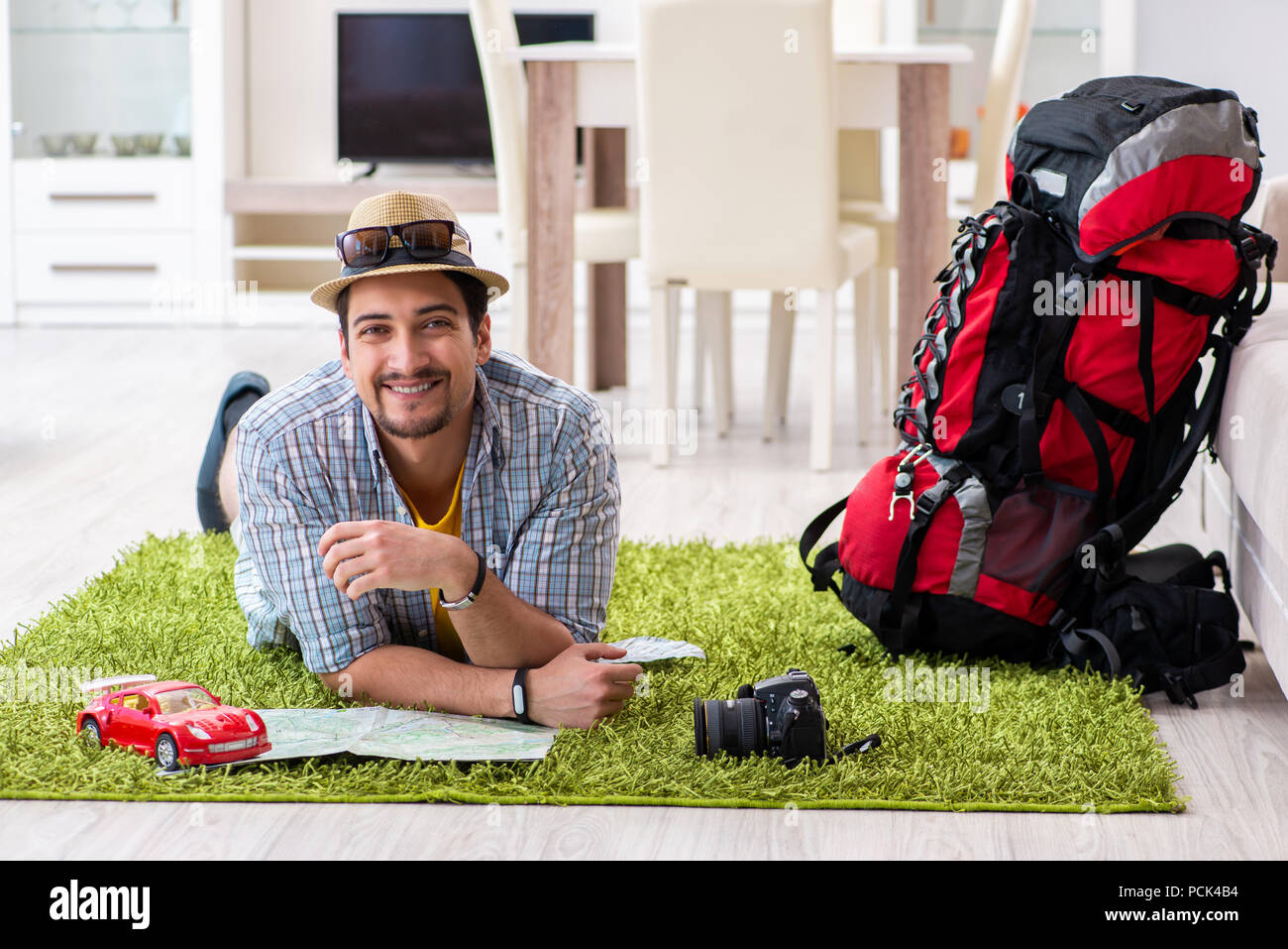 Man planning his travel with map Stock Photo - Alamy