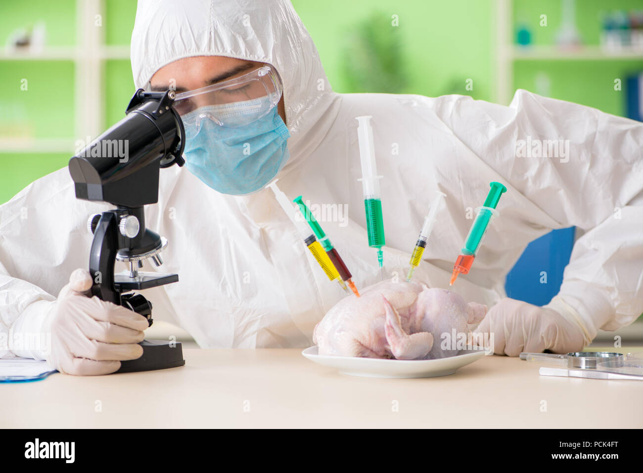 Lab assistant testing GMO chicken Stock Photo - Alamy