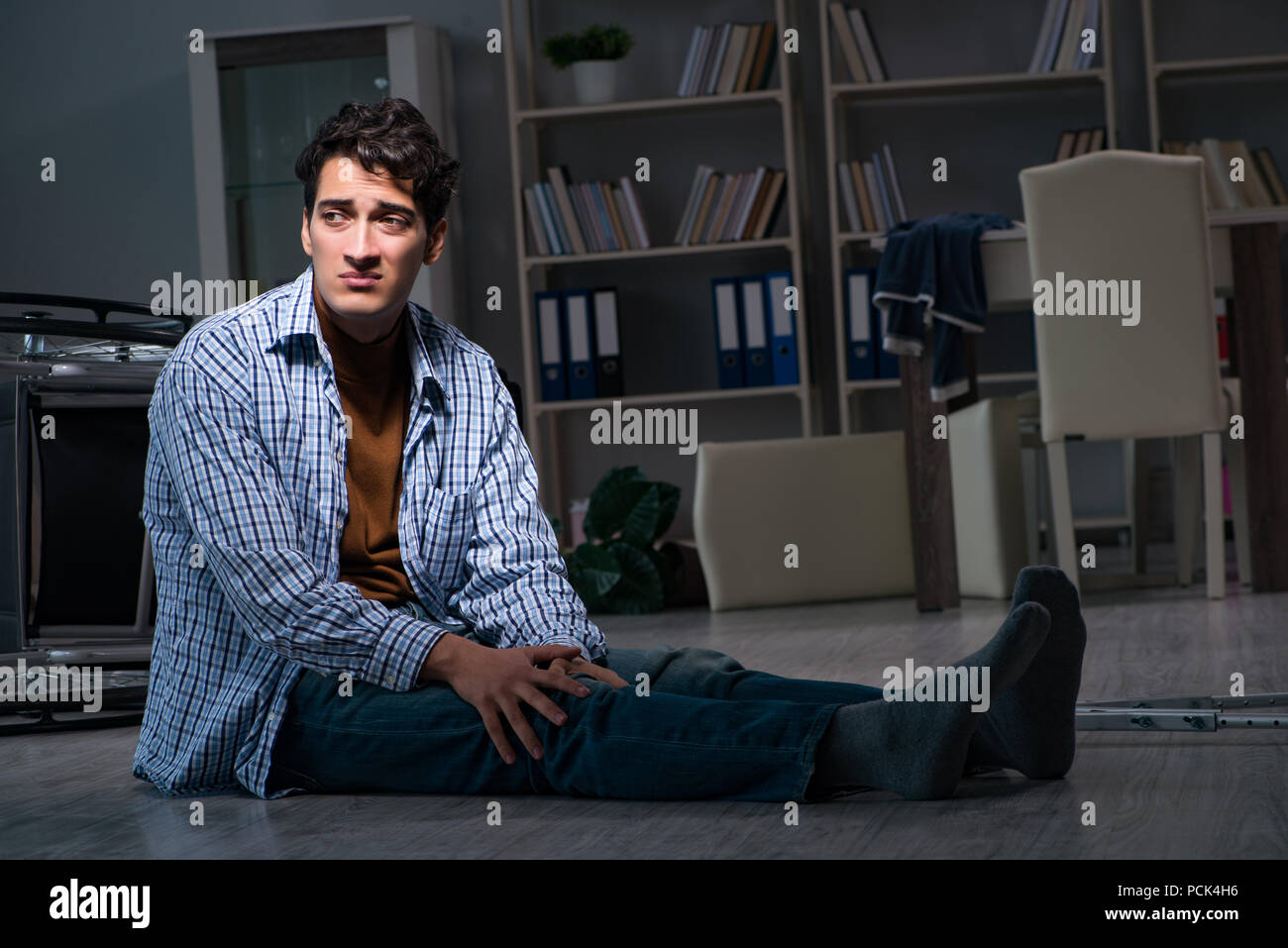 Man falling off chair hi-res stock photography and images - Alamy