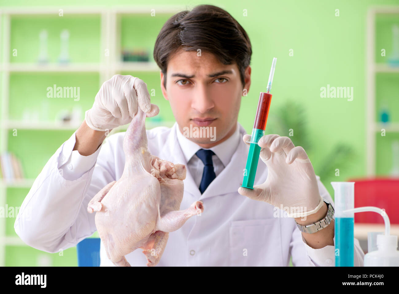 Lab assistant testing GMO chicken Stock Photo - Alamy