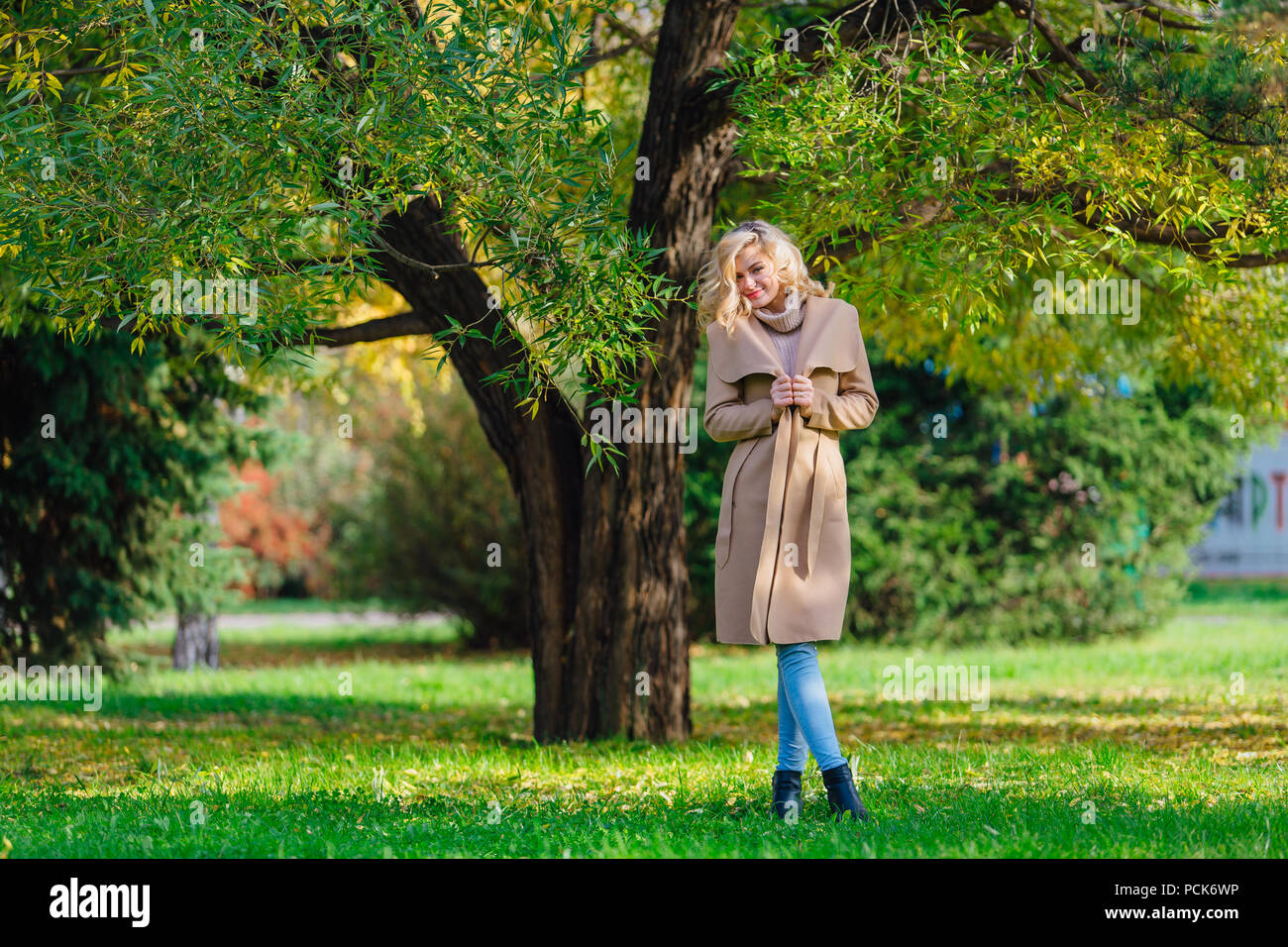 Lady under maple tree hi-res stock photography and images - Alamy