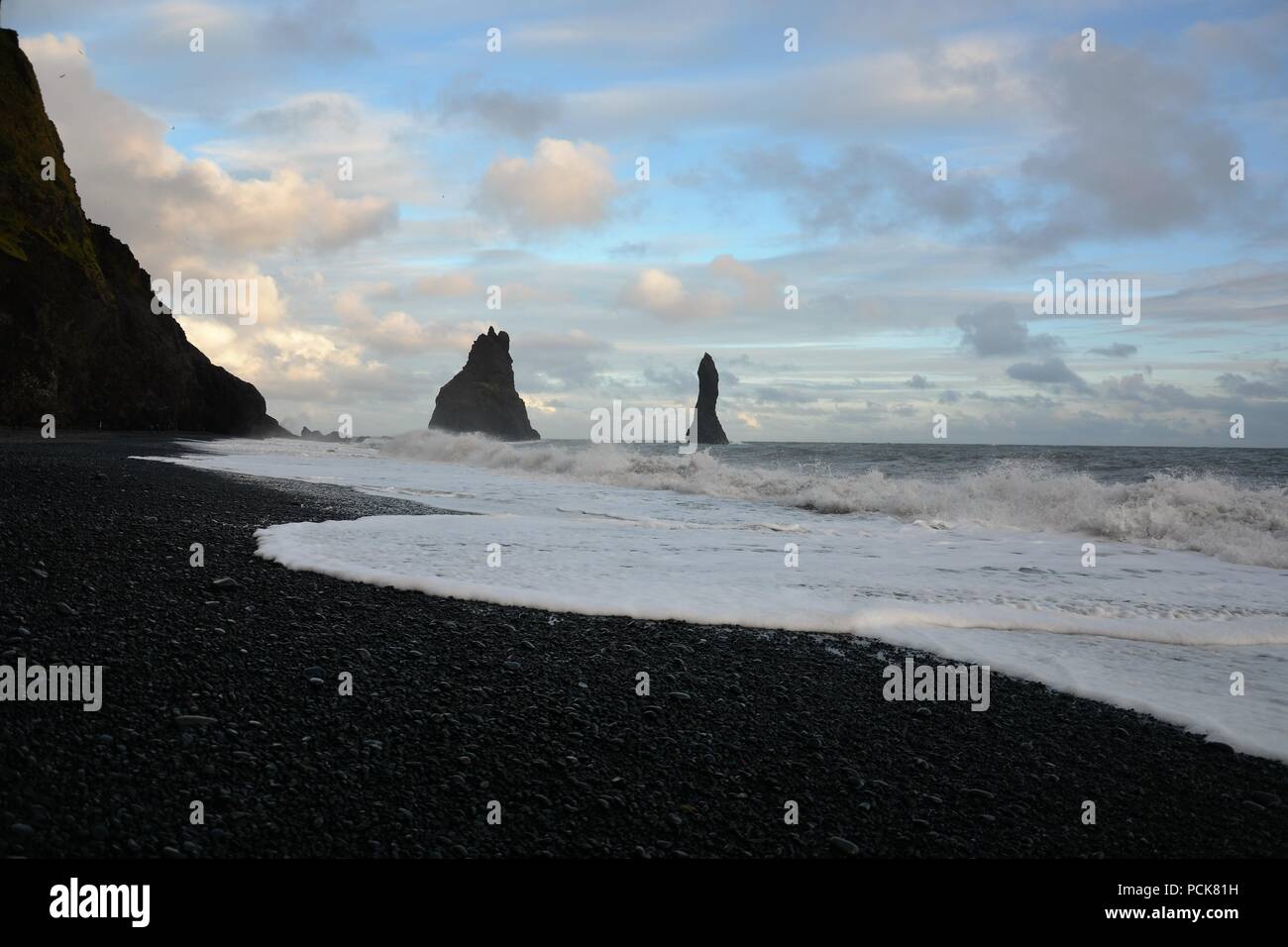 Sea Stacks, cliffs and caves at Black Sand Beach, Reynisfjara ...