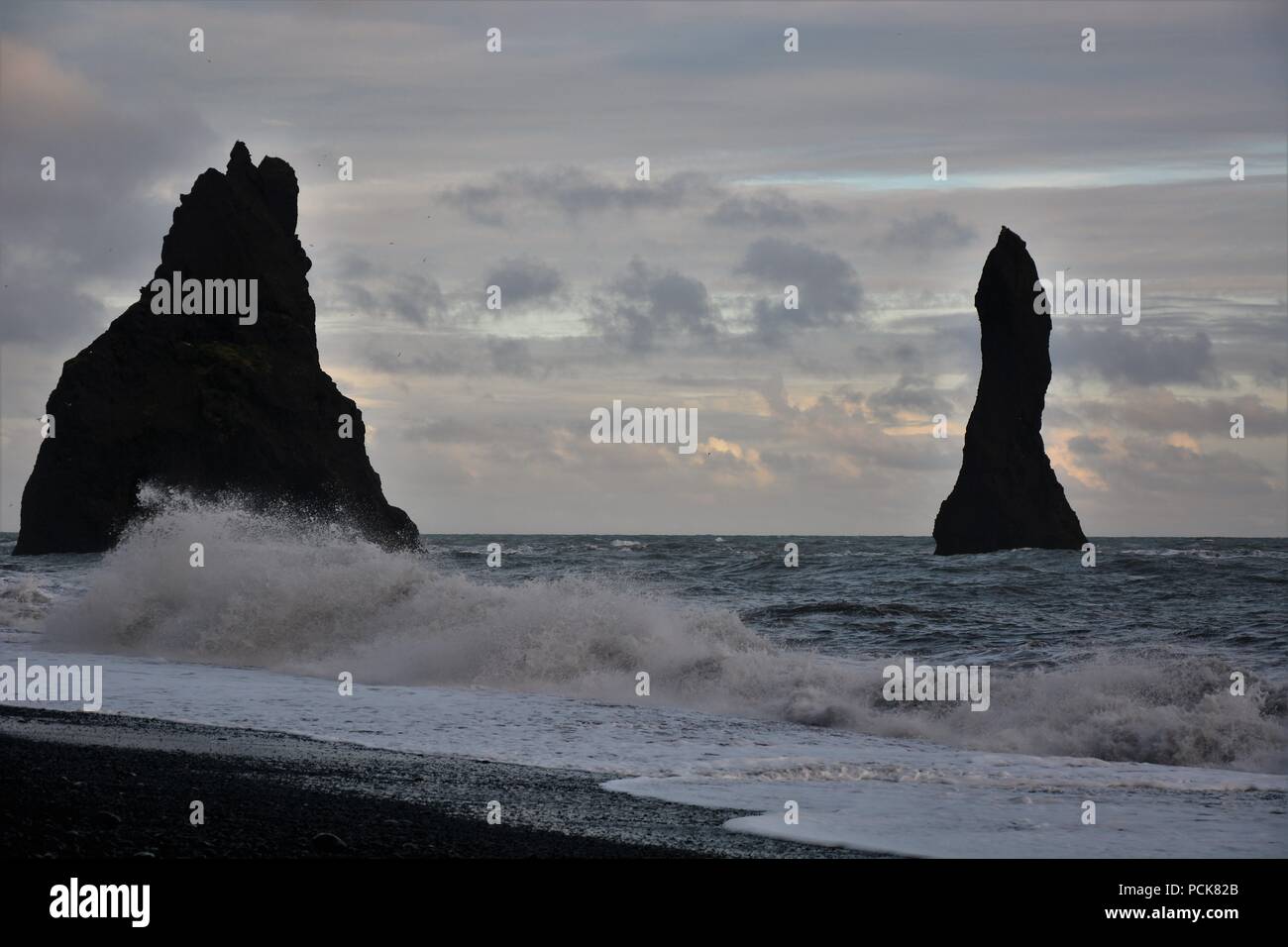 Sea Stacks, cliffs and caves at Black Sand Beach, Reynisfjara ...