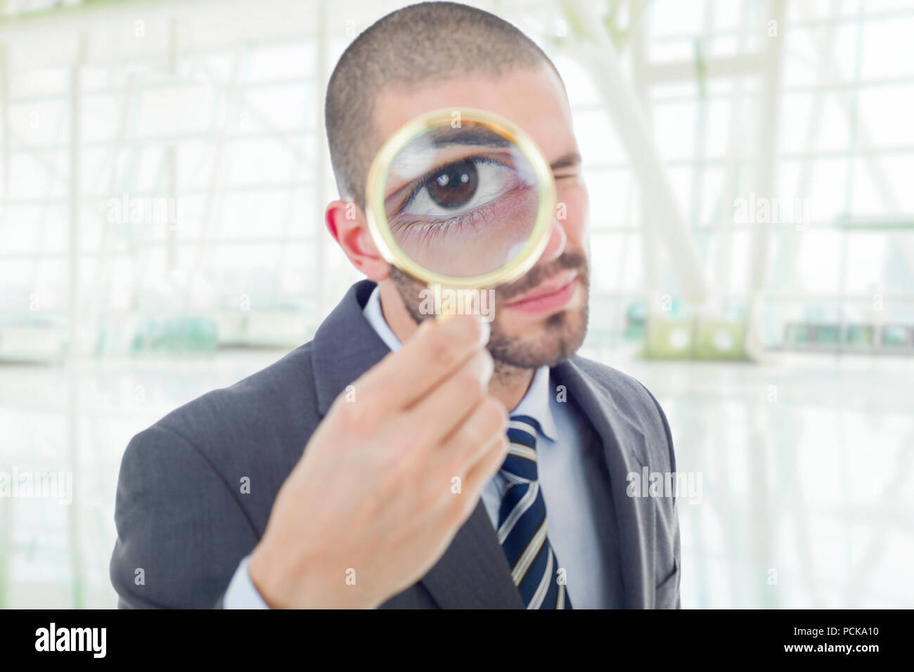 business man with magnifying glass, at the office Stock Photo - Alamy