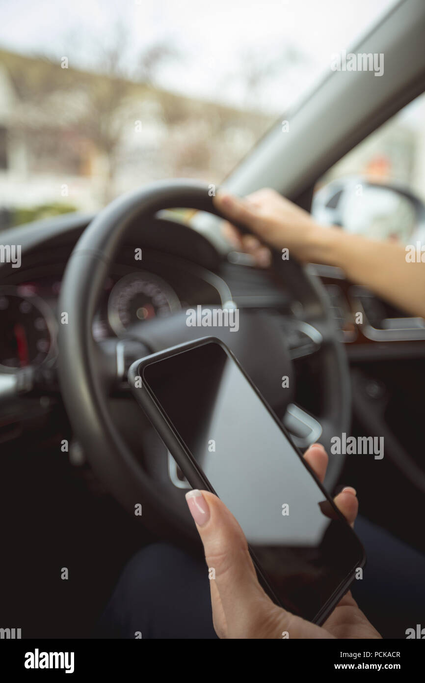 Using mobile phone while driving hi-res stock photography and images ...