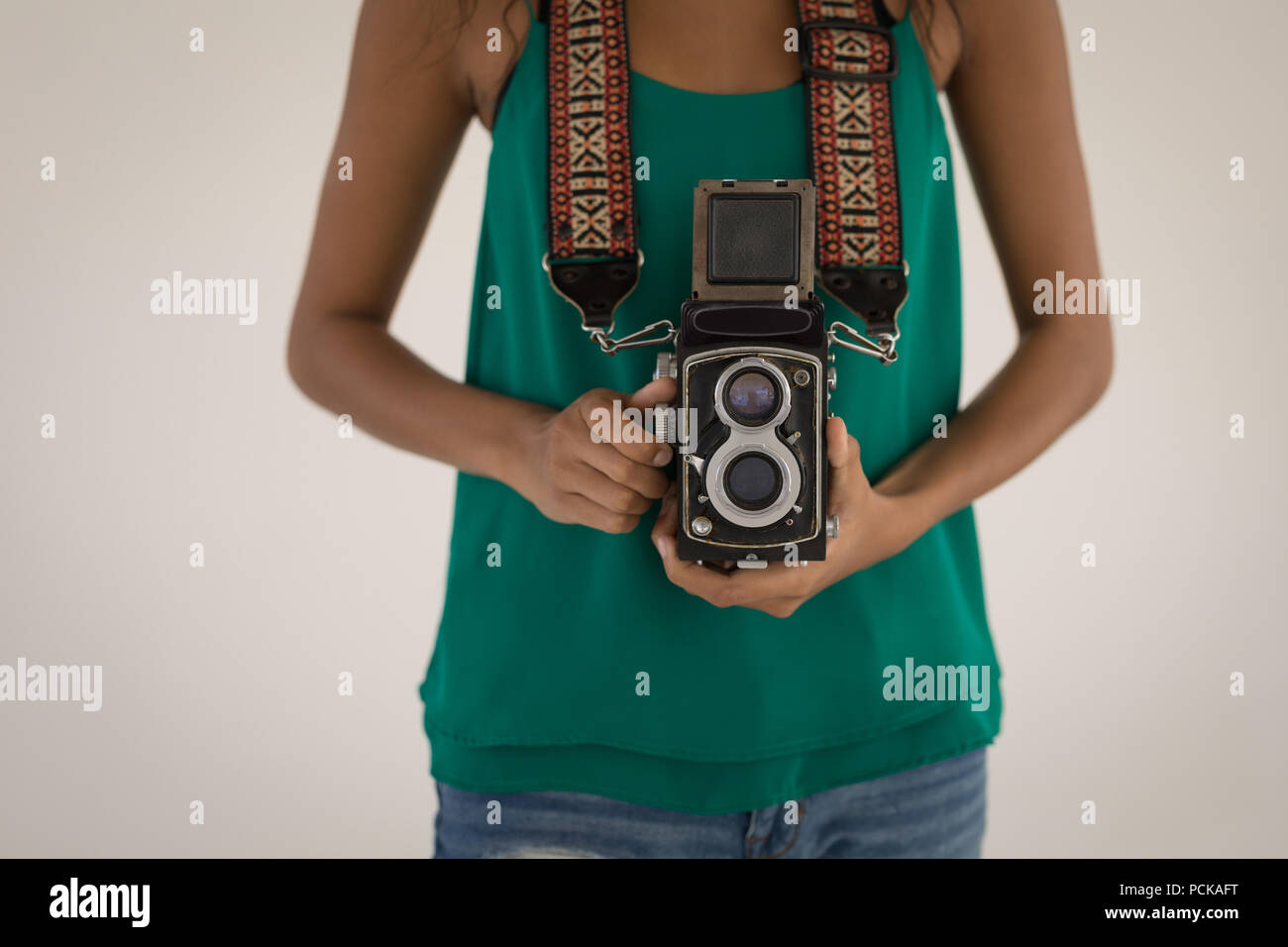 Female Photographer standing with digital camera Stock Photo - Alamy