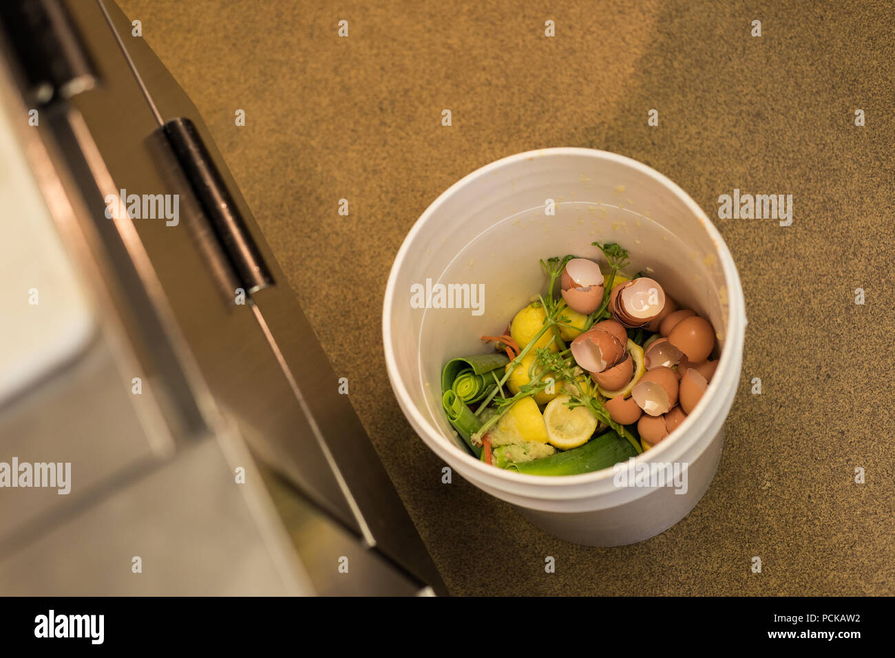 Egg shelves and vegetable waste in the dustbin Stock Photo - Alamy