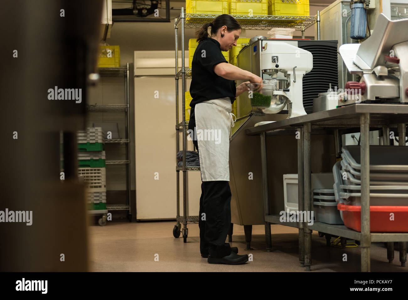 Chef blending the food in machine Stock Photo - Alamy
