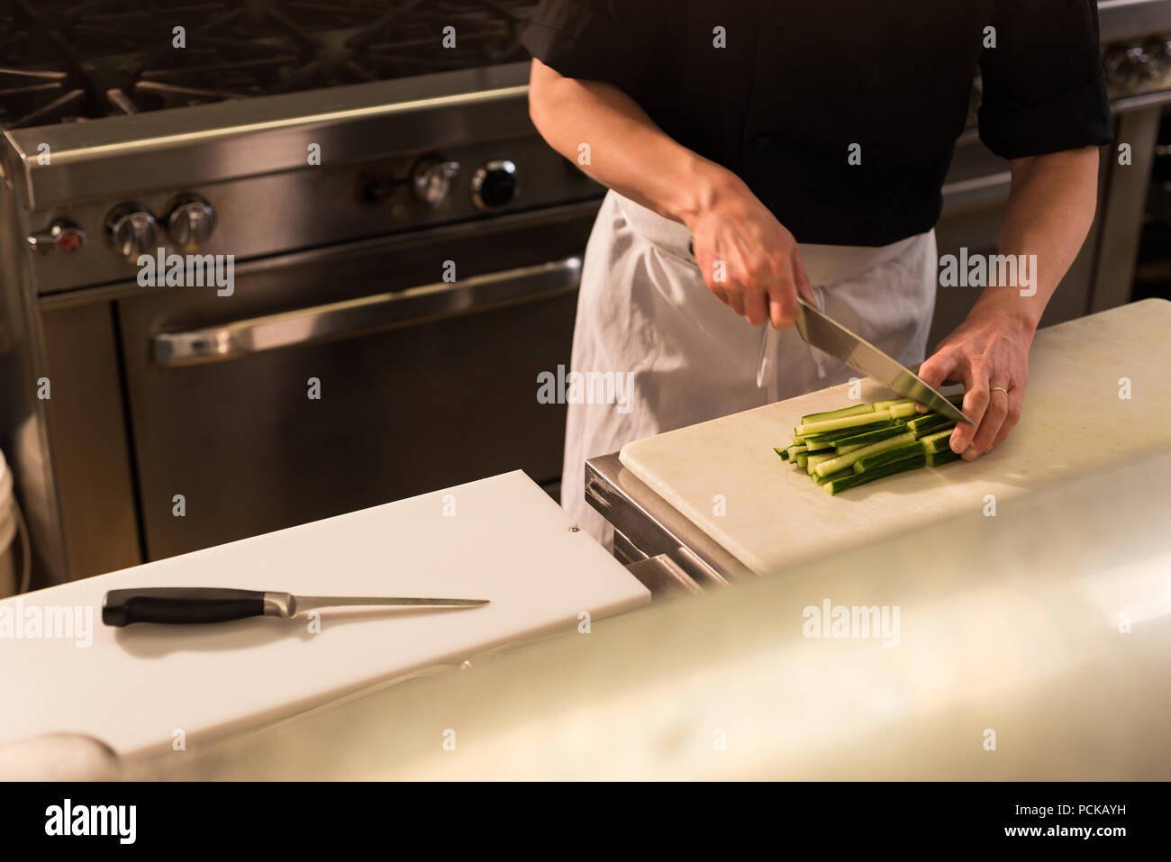 Chef chopping vegetable in the kitchen Stock Photo - Alamy